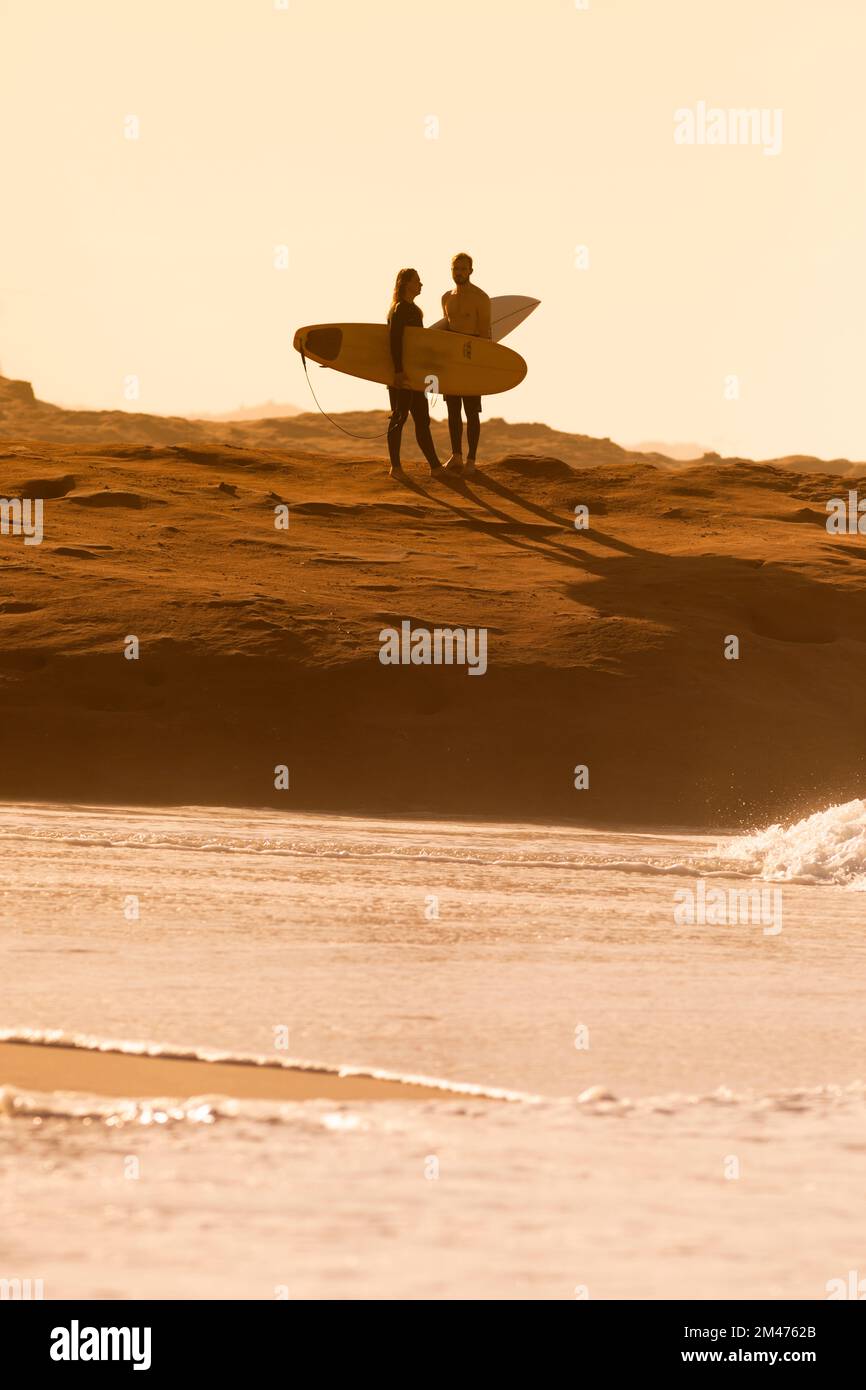 Couple watching the surf hi-res stock photography and images - Alamy