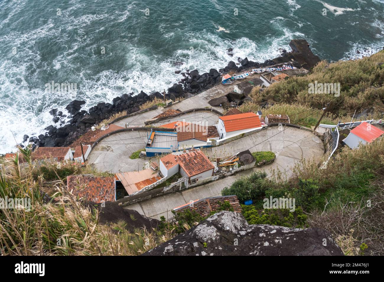 Steep descent toward the small harbor of Porto do Nordeste in the ...