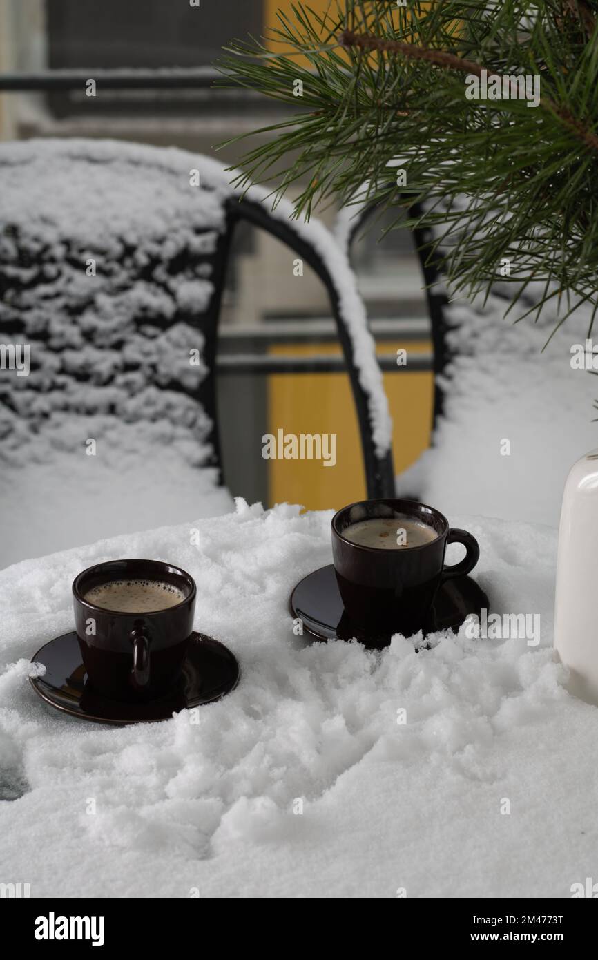 photo two cups of coffee on the table covered with snow Stock Photo - Alamy