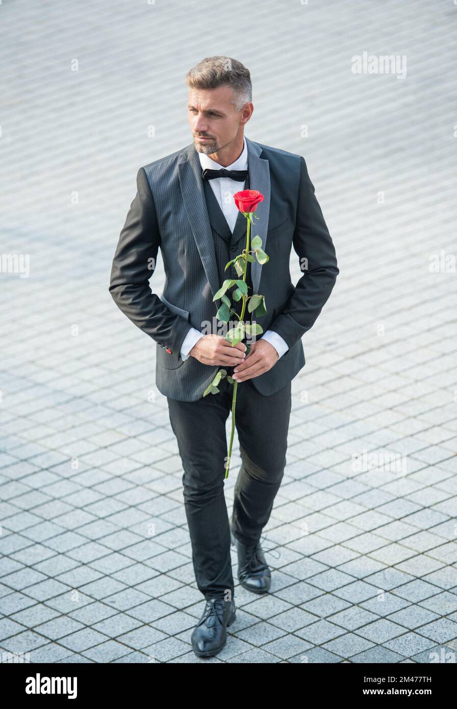 engagement date. full length of tuxedo man celebrates engagement. man ...