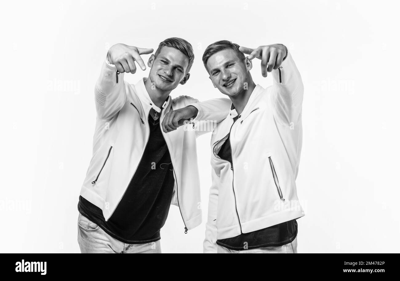 family relations and friendship. men friends. two cousin pointing ...