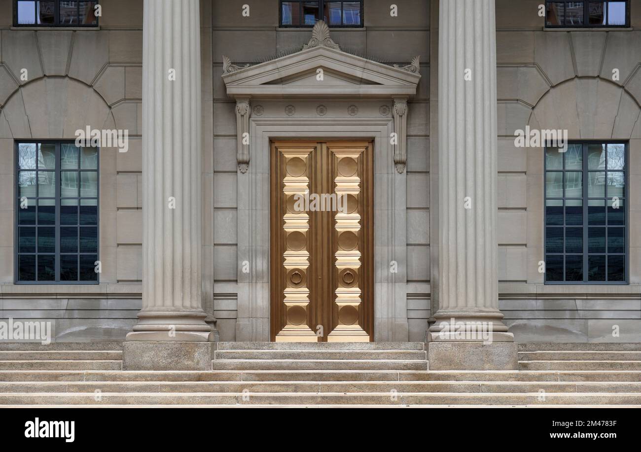 Entrance to classical style office building with stone columns and ...