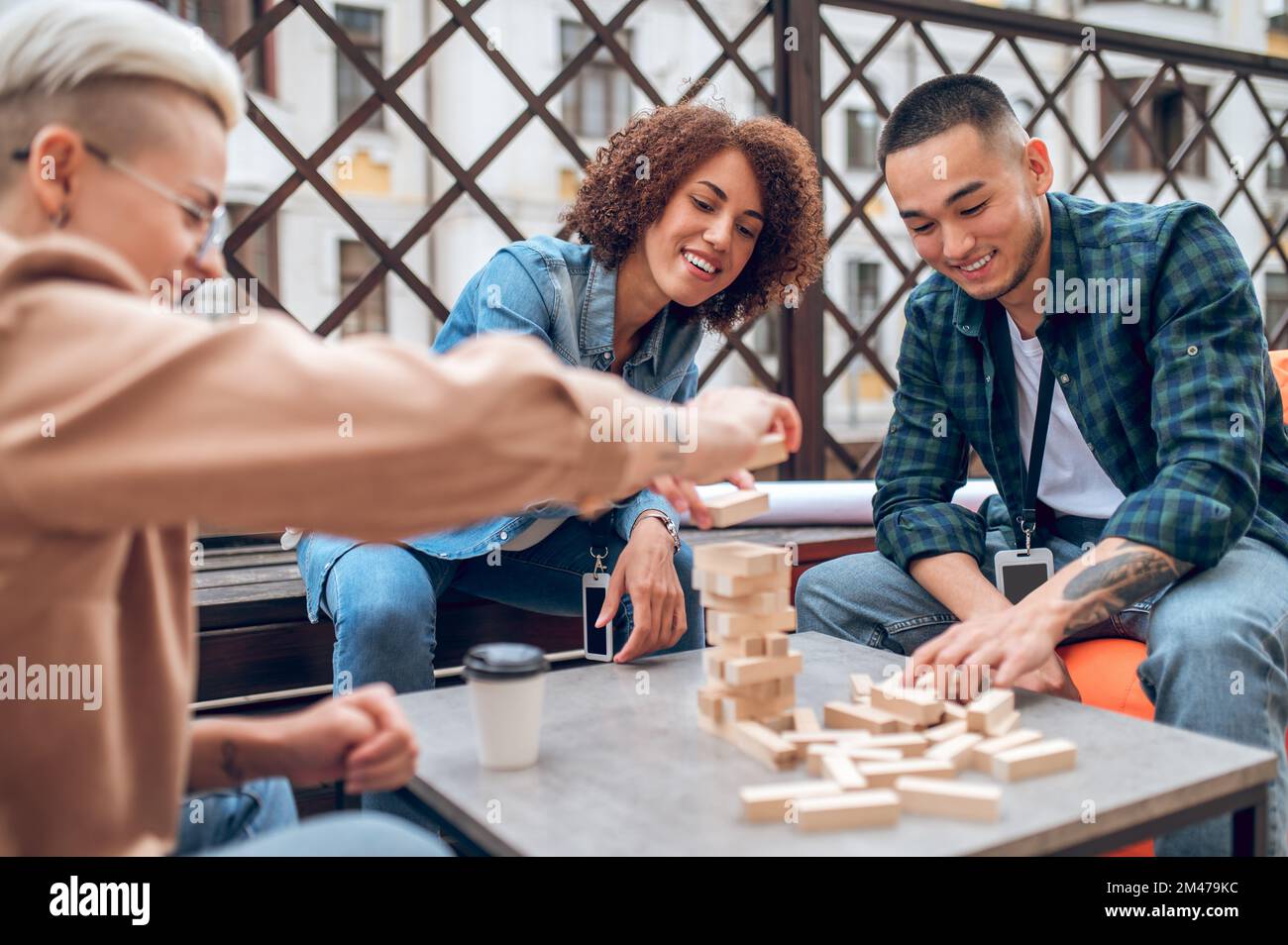 Corporate workers playing a board game on the office veranda Stock ...