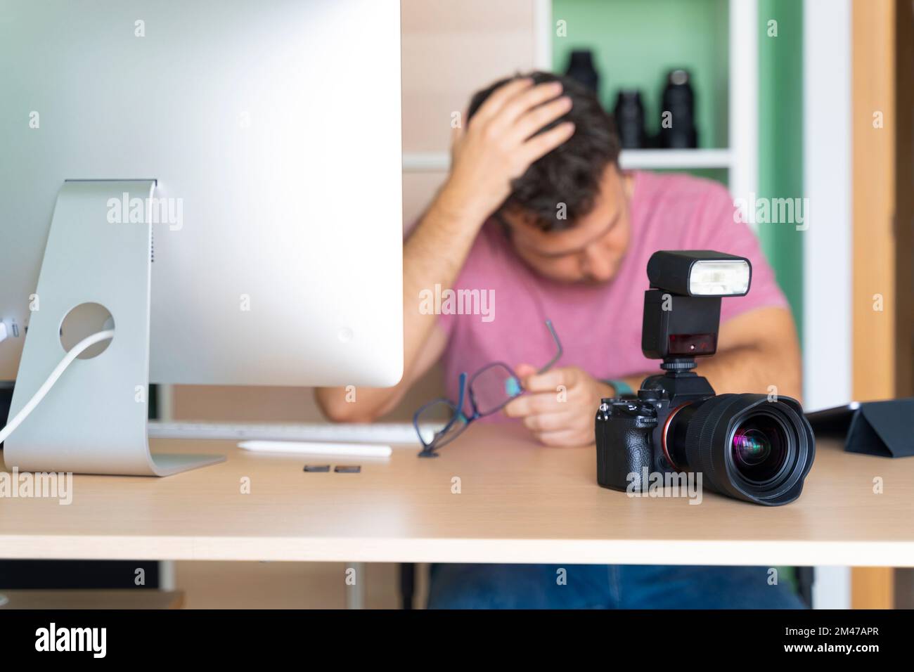 Man in his office worried about his photos on the computer Stock Photo ...