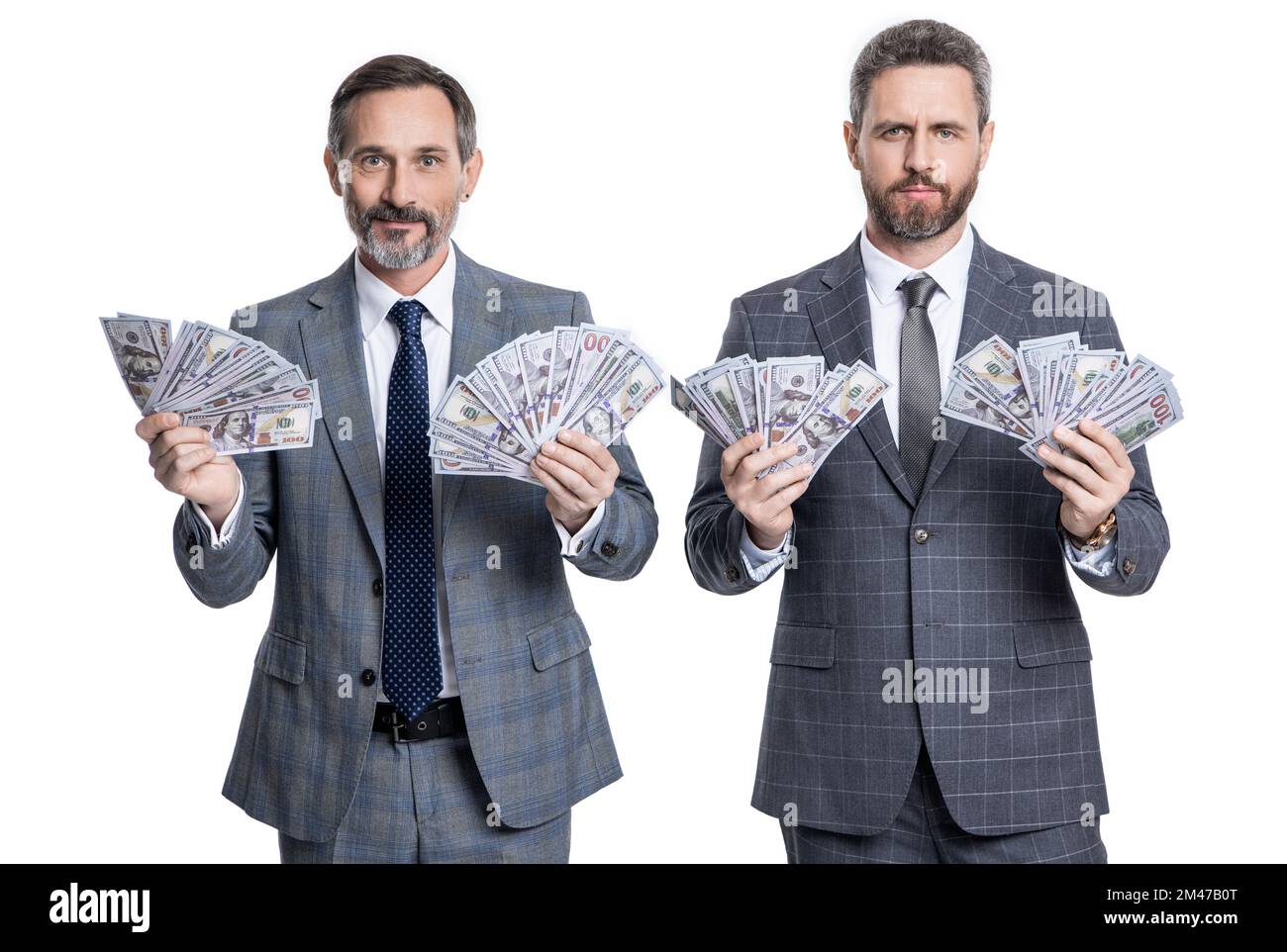 millionaire men hold money in studio. millionaire men hold money dollar ...