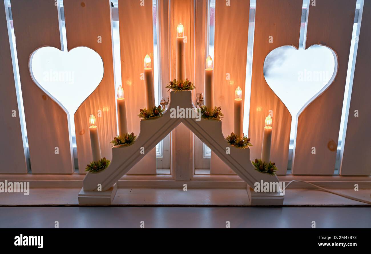 seven armed electric advent candlestick standing in window Stock Photo ...