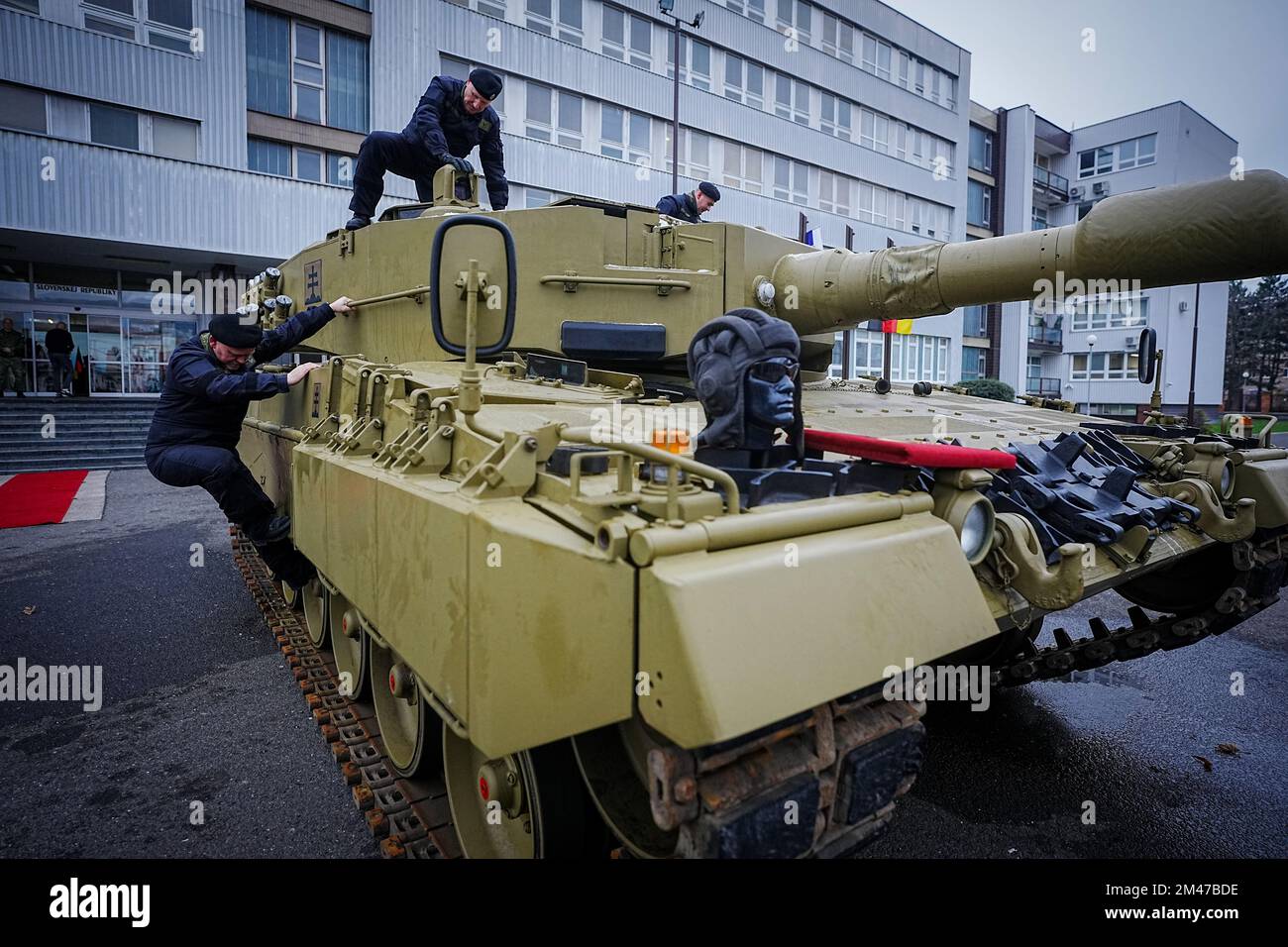 Bratislava, Slovakia. 19th Dec, 2022. Slovakian soldiers climb onto the ...