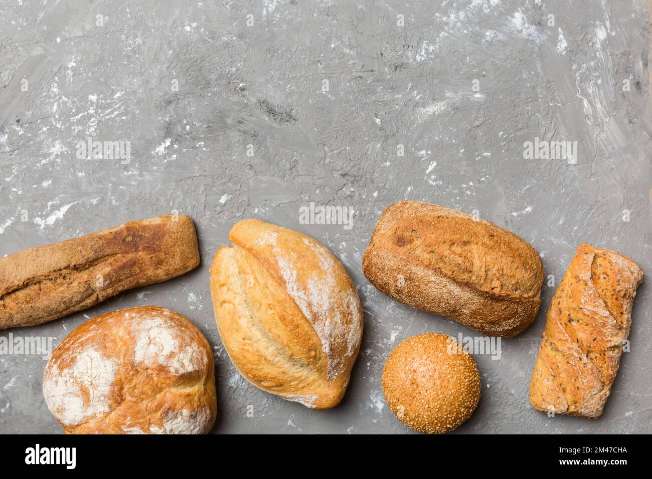 Homemade natural breads. Different kinds of fresh bread as background ...