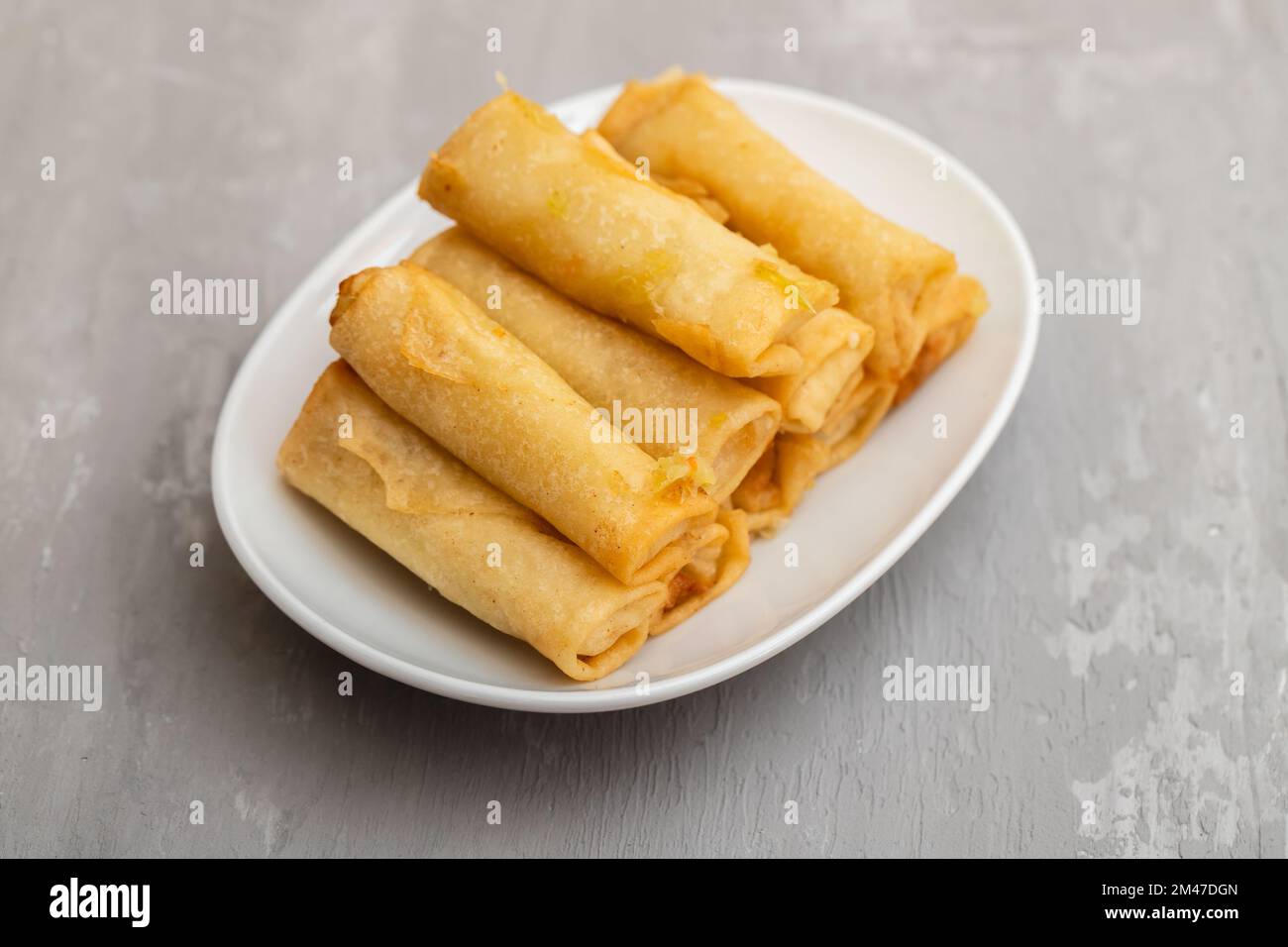Spring Roll also known as Egg Roll on white dish Stock Photo - Alamy