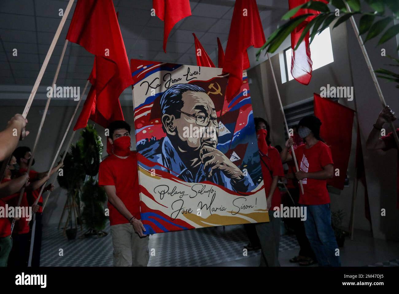 Manila, Philippines. 19th Dec, 2022. Filipino activists carry flags and ...