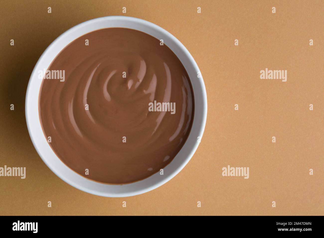 Swirl in a cup of hot chocolate top view isolated on white Stock Photo ...
