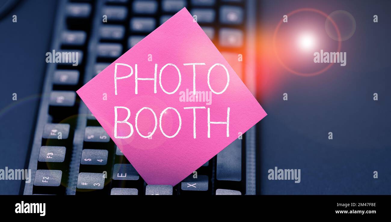 Hand writing sign Photo Booth. Concept meaning form of photo sharing ...