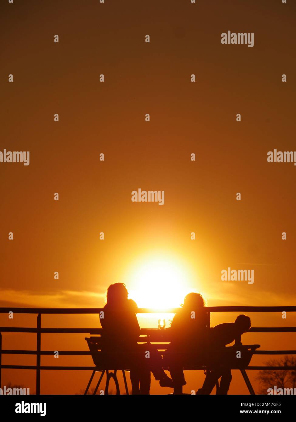 Group of people enjoying sunset hi-res stock photography and images - Alamy