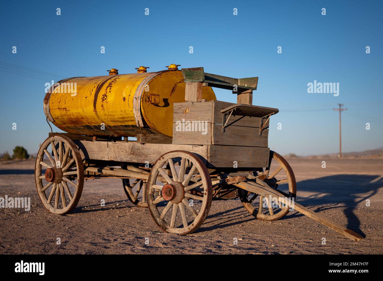 horse-drawn wooden cart with a yellow tank Stock Photo - Alamy
