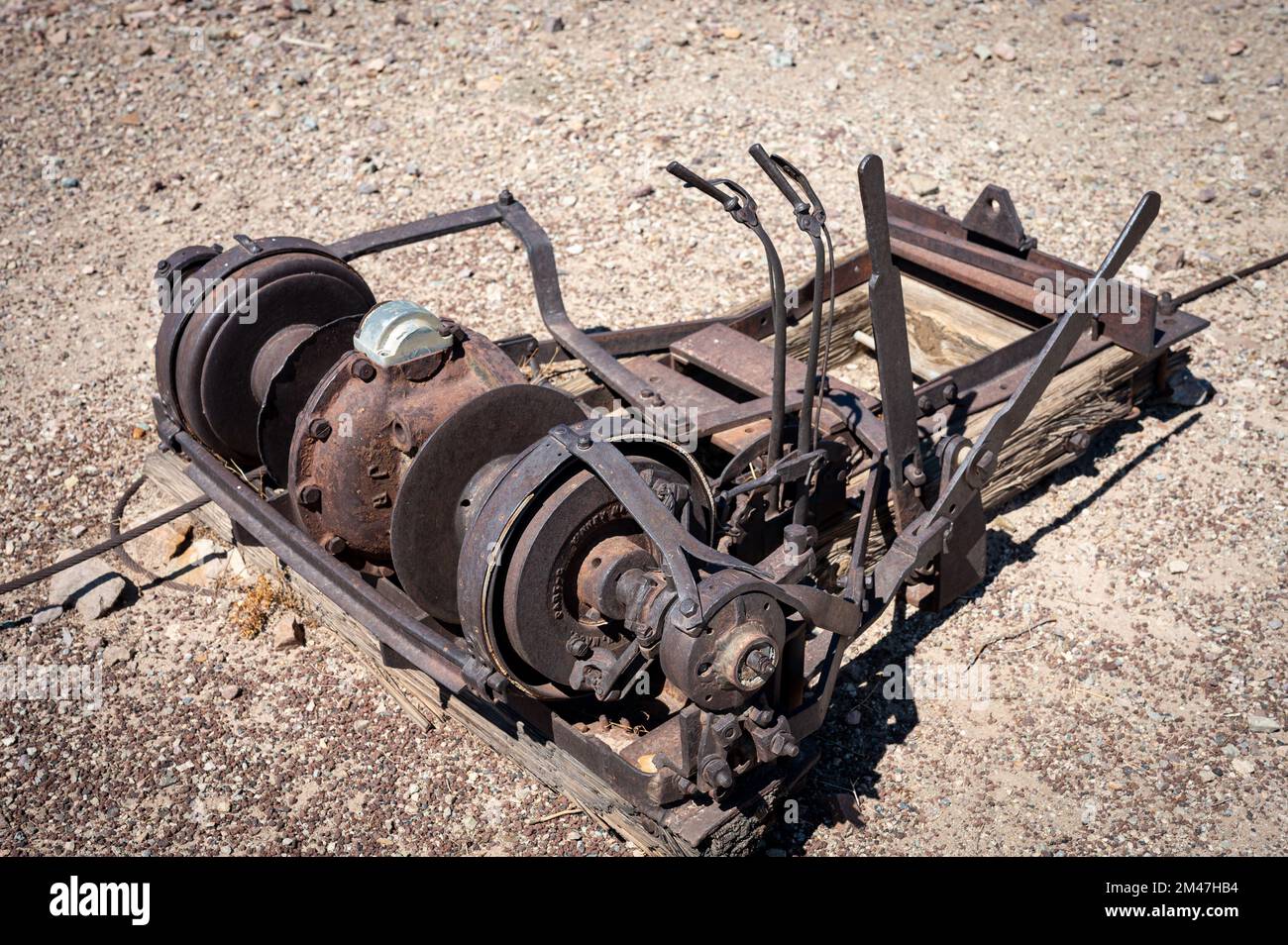 Detail of an old cable and belt traction system abandoned in the desert ...