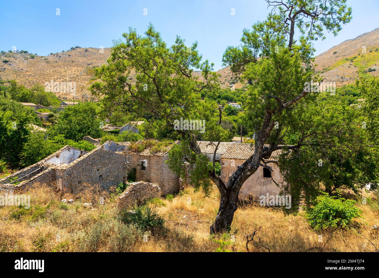 Ruins of the abandoned village of Perithia, Corfu, Greece Stock Photo ...