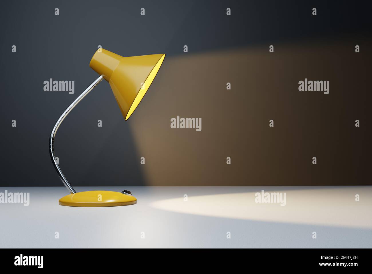 Yellow desk lamp with a light cone shining spot light on the table ...