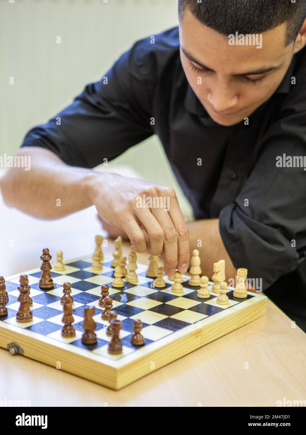 Gaming Teenagers: Chess Move. Intense concentration on the face of a ...