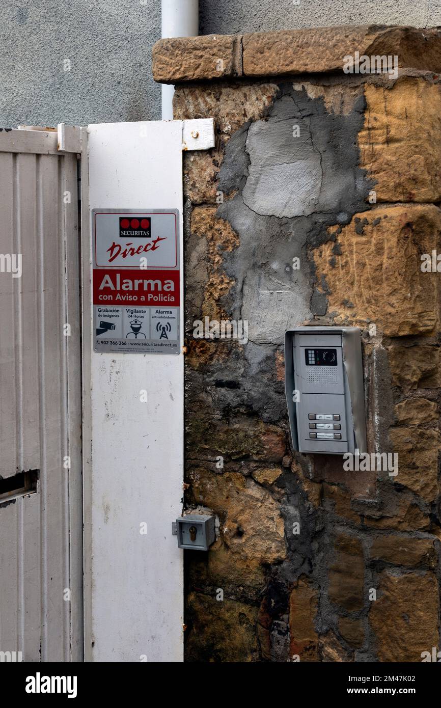 Securitas Alarma sign on a house gate entrance in Spain Stock Photo - Alamy