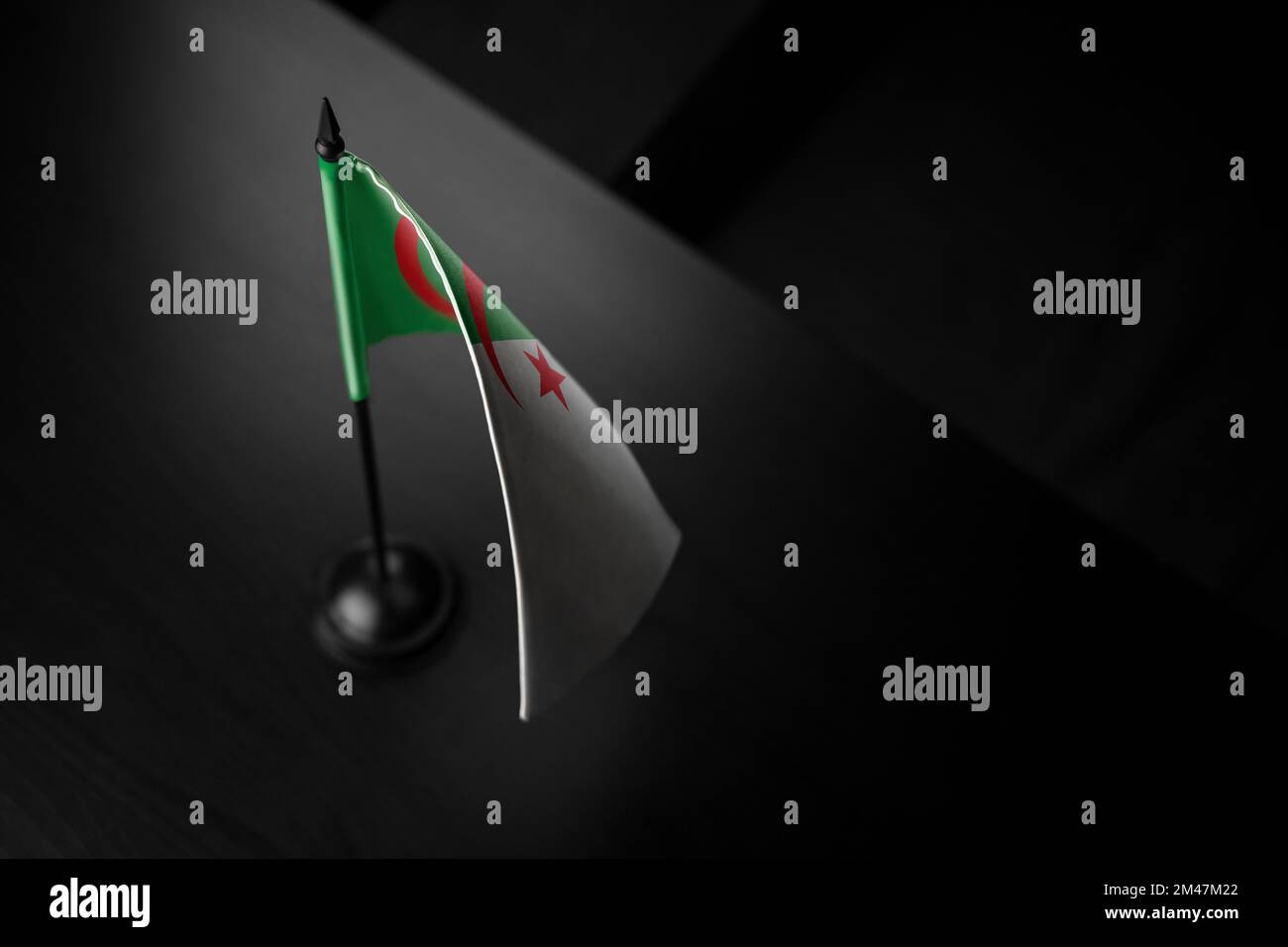 Small national flag of the Algeria on a black background Stock Photo ...
