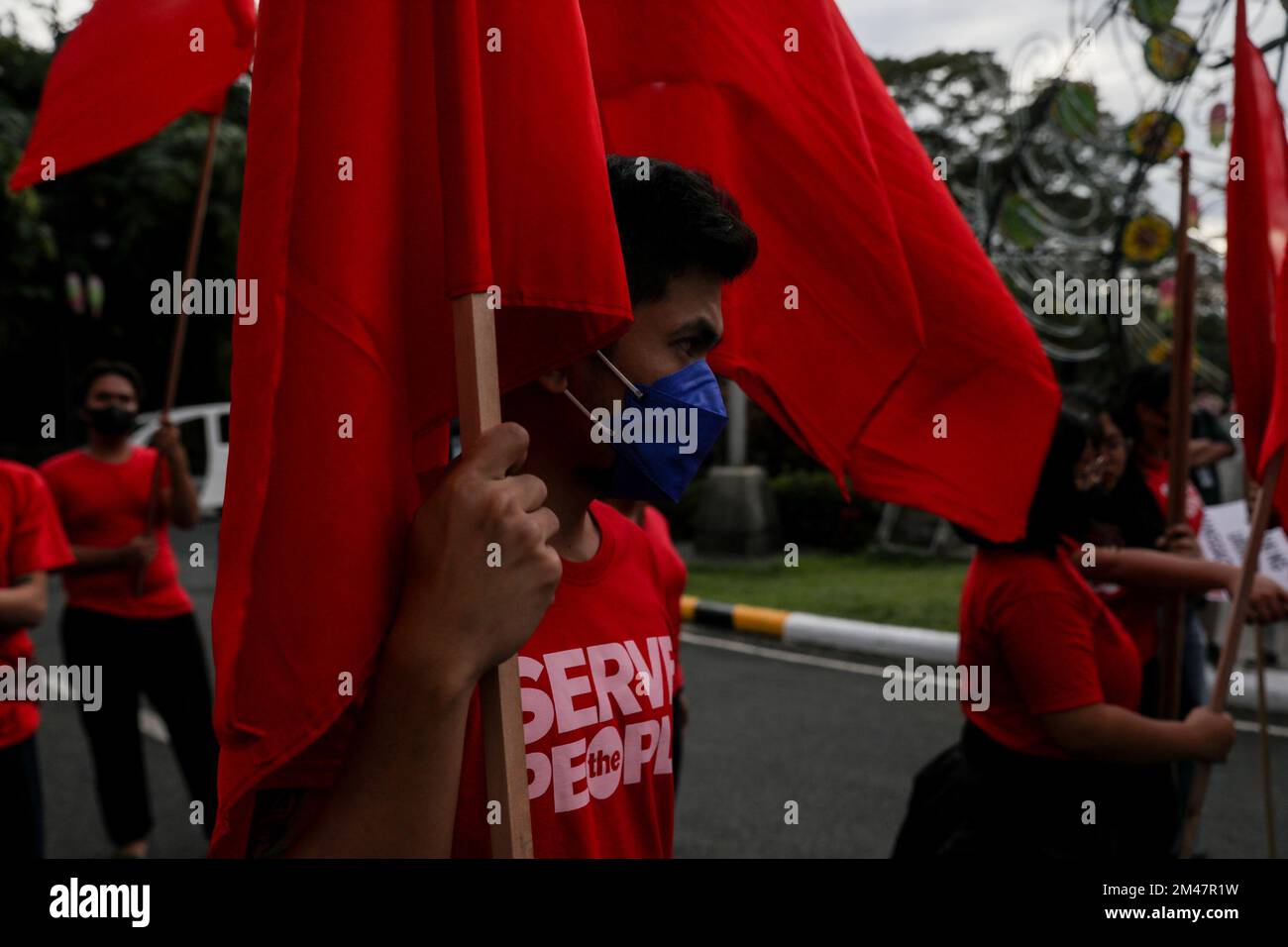 Manila, Philippines. 19th Dec, 2022. Filipino activists carry flags and ...