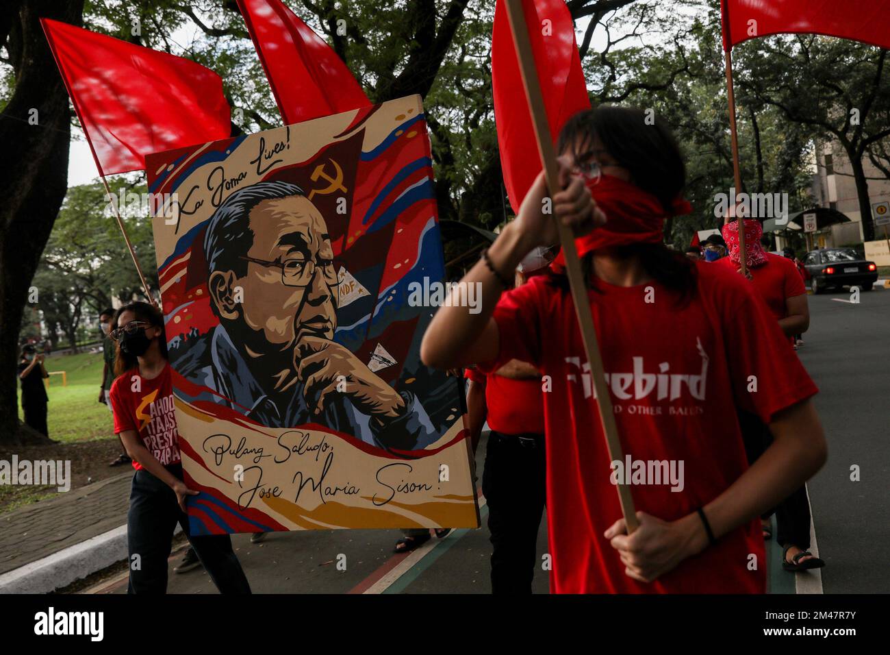 Manila, Philippines. 19th Dec, 2022. Filipino activists carry flags and ...