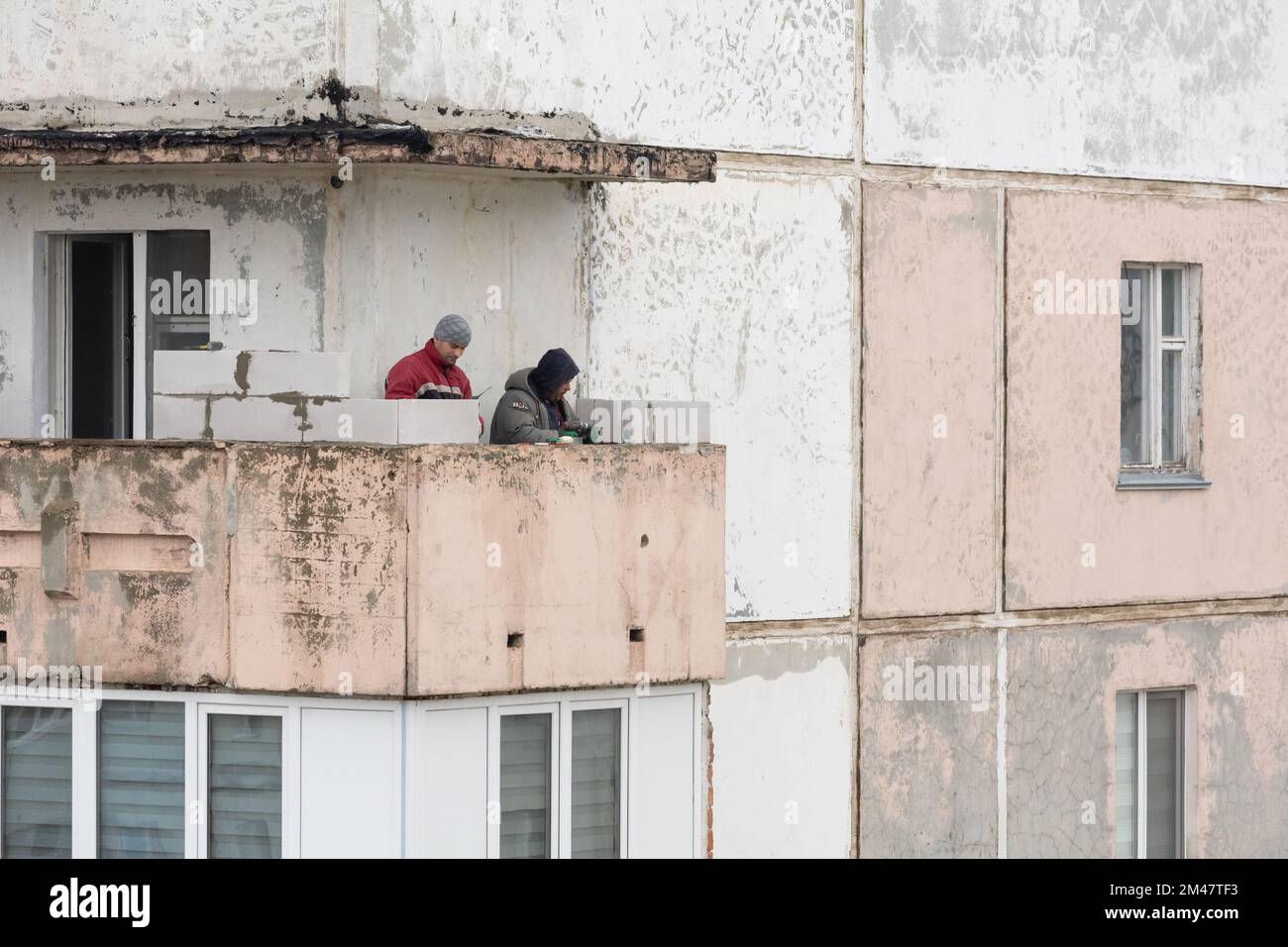 Tiraspol, Moldova - November 29, 2022: Balcony insulation. Builders ...