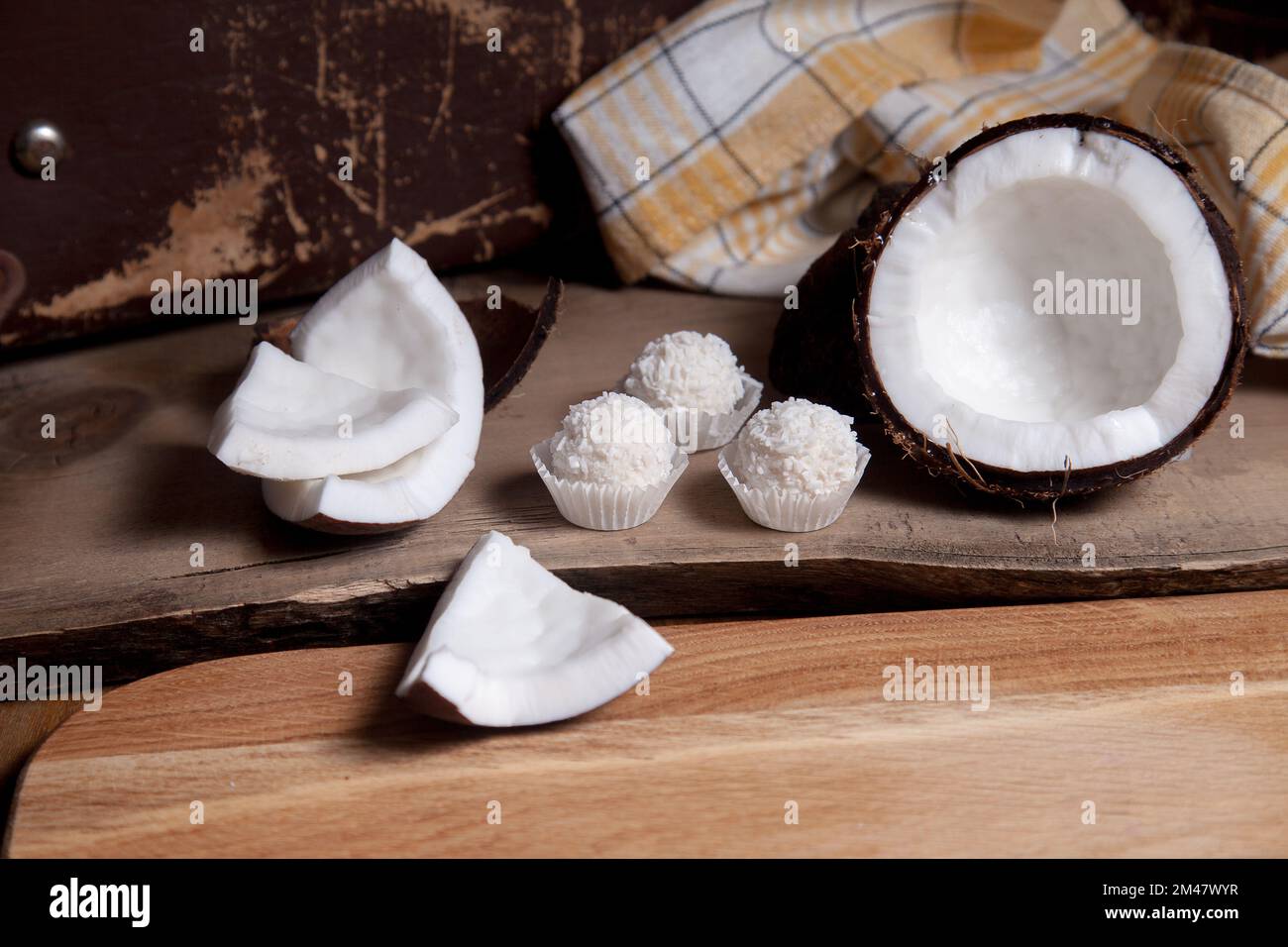 Coconut and sweet chocolate coconut truffles. Coconut shell, coconut ...