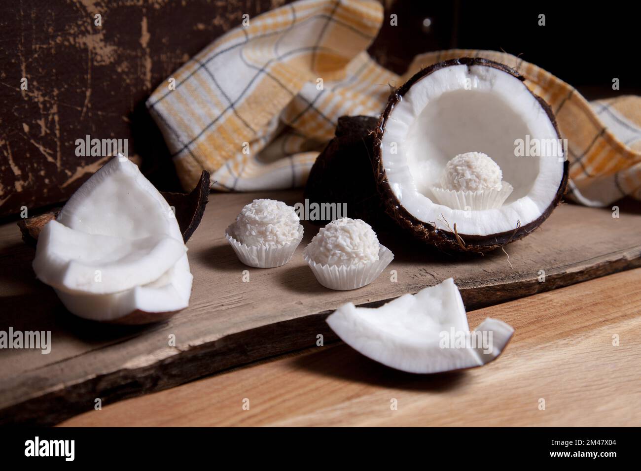 Coconut and sweet chocolate coconut truffles. Coconut shell, coconut ...