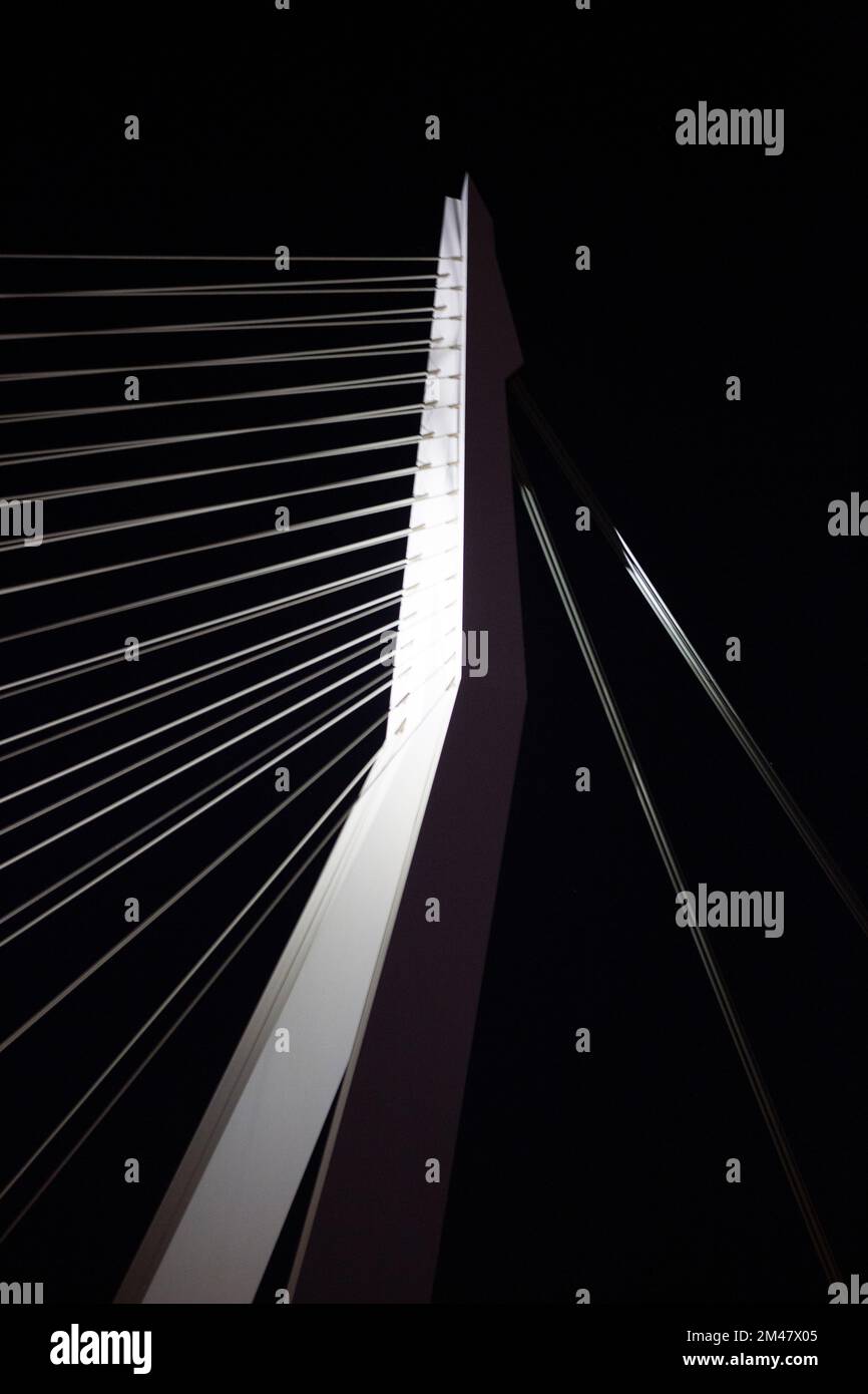 Nighttime architectural detail lit up of Erasmus bridge infrastructure ...