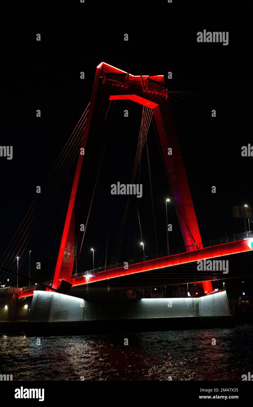 Night time urban scenery with steel draw bridge in glowing red in ...