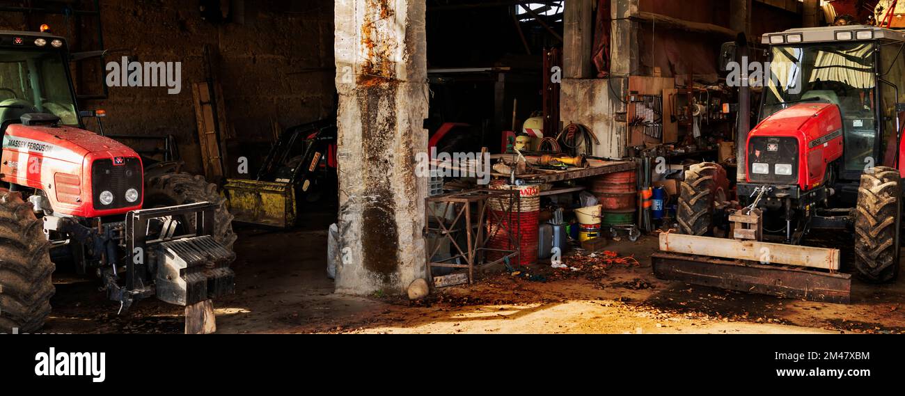 Tractors in a barn Stock Photo - Alamy