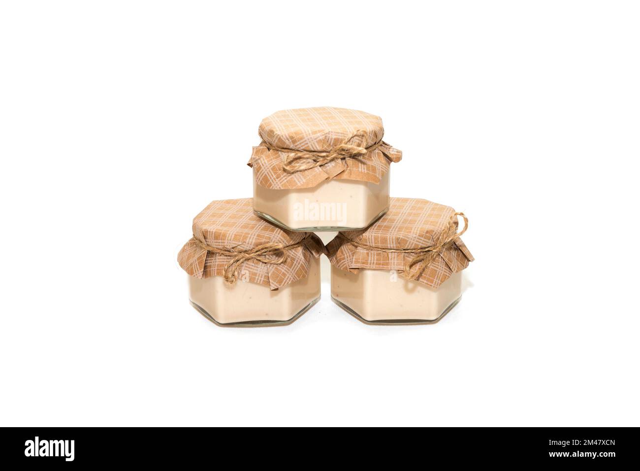 Three glass jars with jam on a white background Stock Photo - Alamy