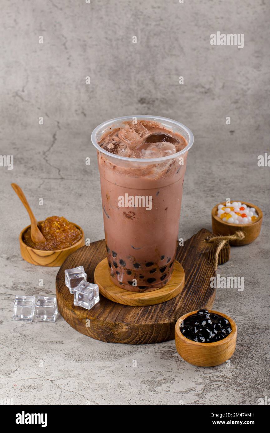 Boba or tapioca pearls is taiwan bubble milk tea in plastic cup with ...