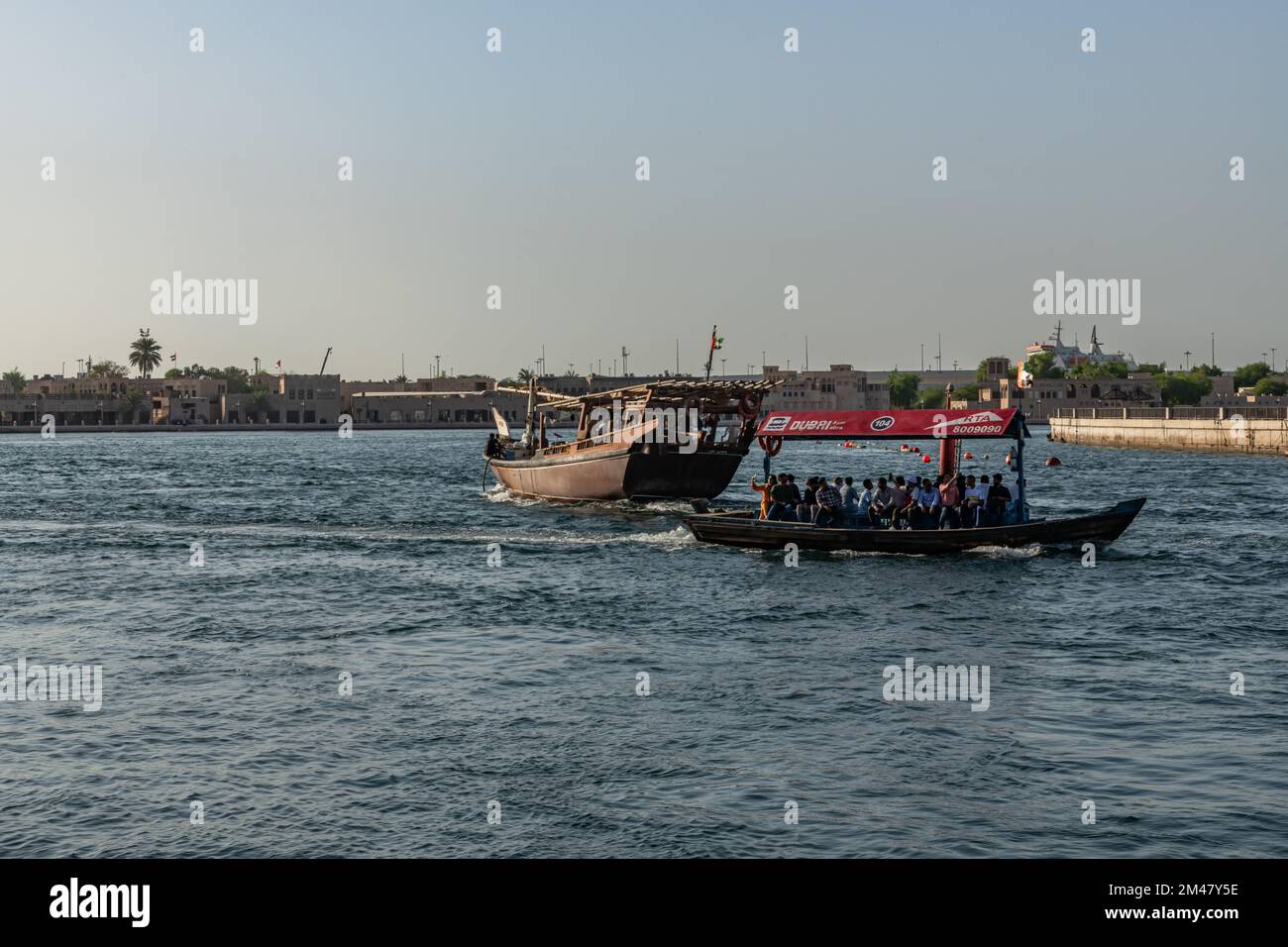 The view while cruising on an Abra - a traditional boat made of wood ...