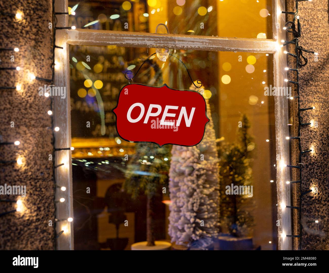 Open, text on signboard, sign board on shop, store window on winter ...