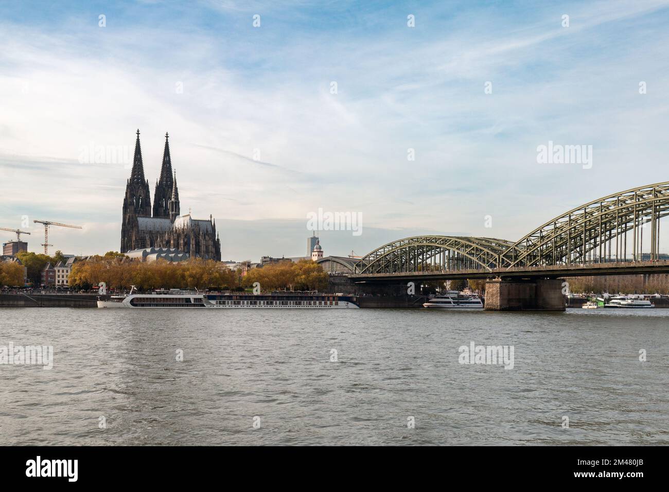 Cologne Cathedral and Hohenzollern bridge from across the Rhine river ...
