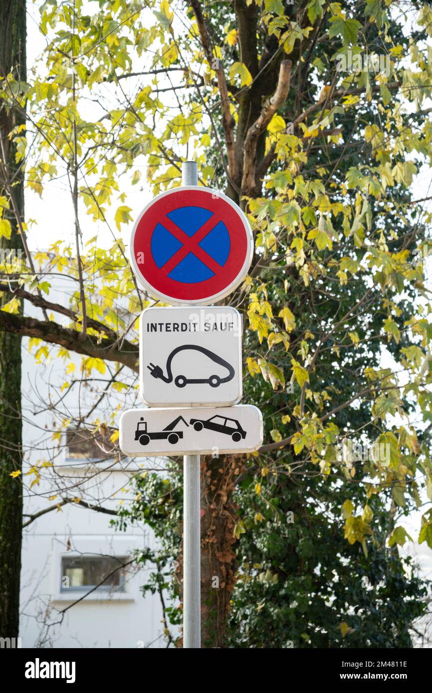 Traffic signs, no parking and car evacuation except for rechargeable ...