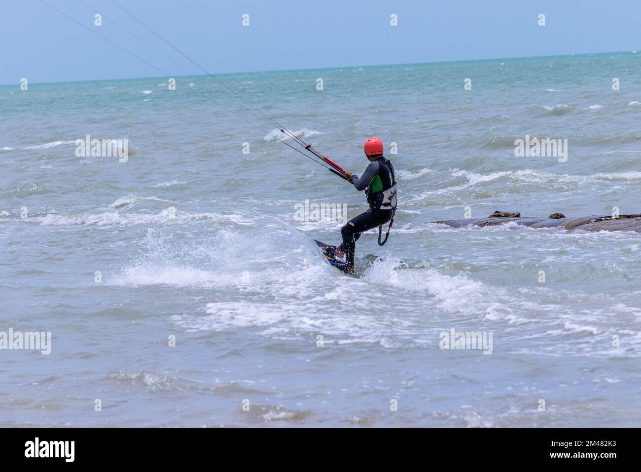 A man wind surfing at Cancun beach, Mexico Stock Photo - Alamy