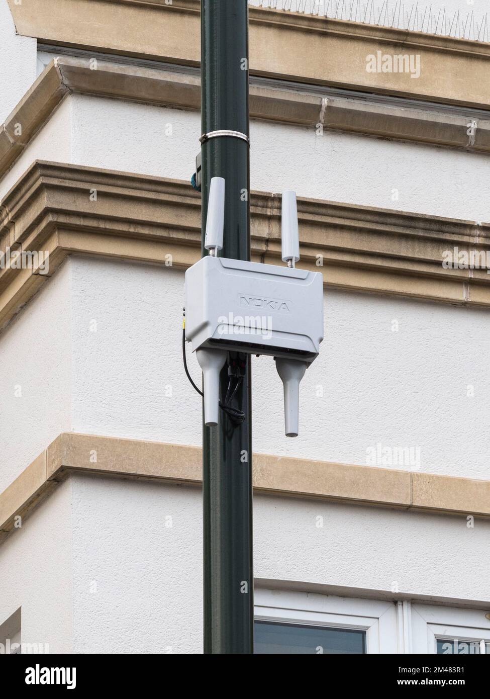 A Nokia branded 5G transmitting box operated by Cellnex UK mounted on a ...