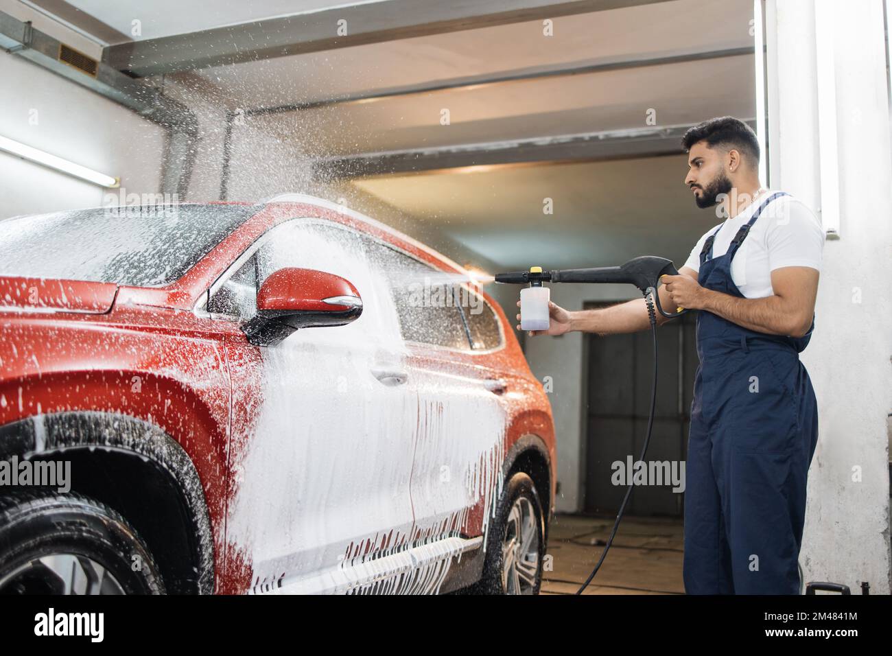 Side view male hand spraying hi-res stock photography and images - Alamy