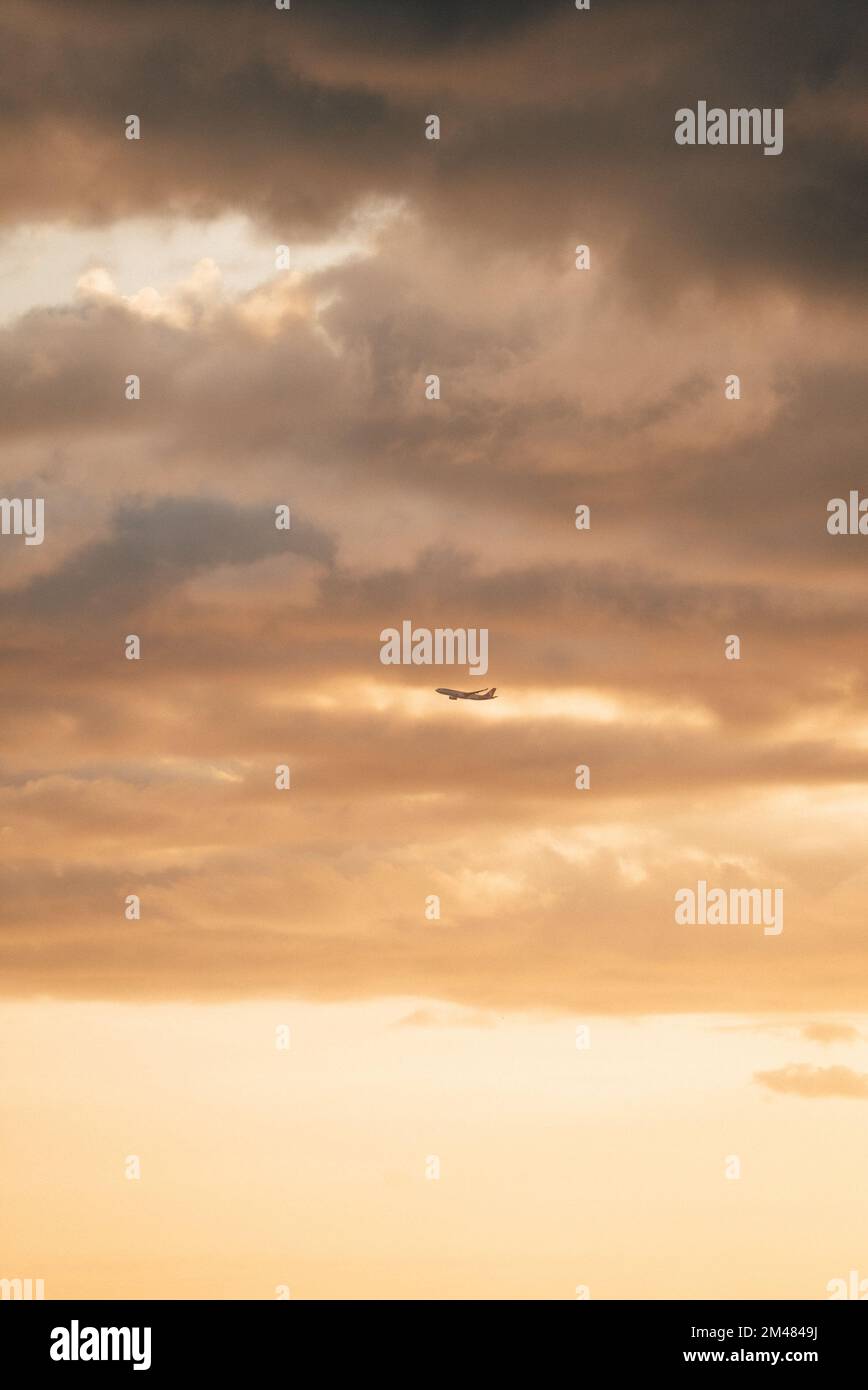 Plane taking off during sunset Stock Photo - Alamy