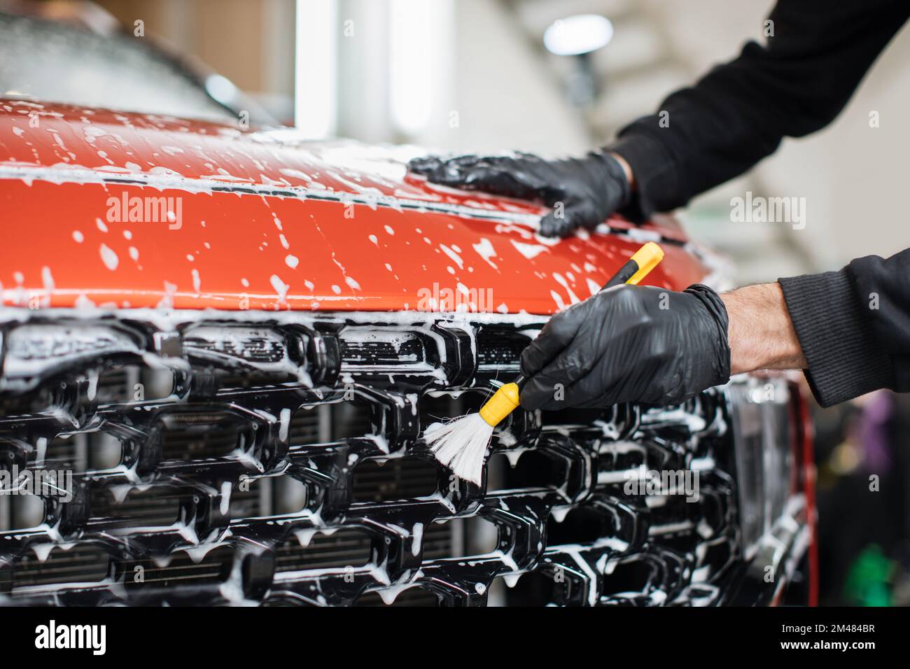 Closeup view of hand with special yellow brush of wash worker cleaning ...