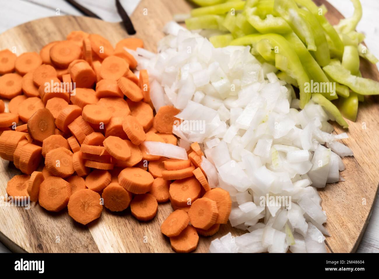 Chopped fresh peppers, onions, carrots. Vegetarianism concept. Mix of ...