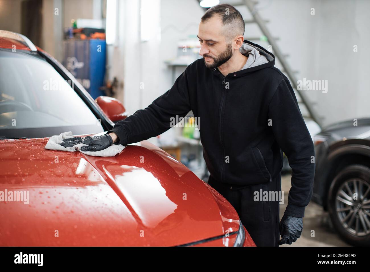 Car detailing and cleaning concept. Good-looking young male car wash ...