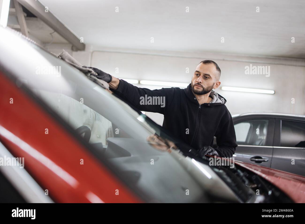 Car detailing and cleaning concept. Good-looking young male car wash ...