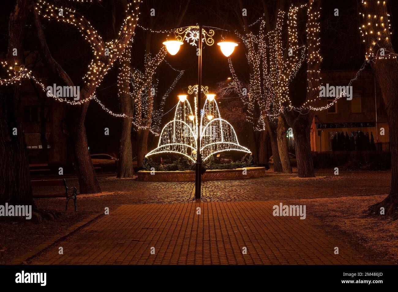 christmas tree in night city Stock Photo - Alamy