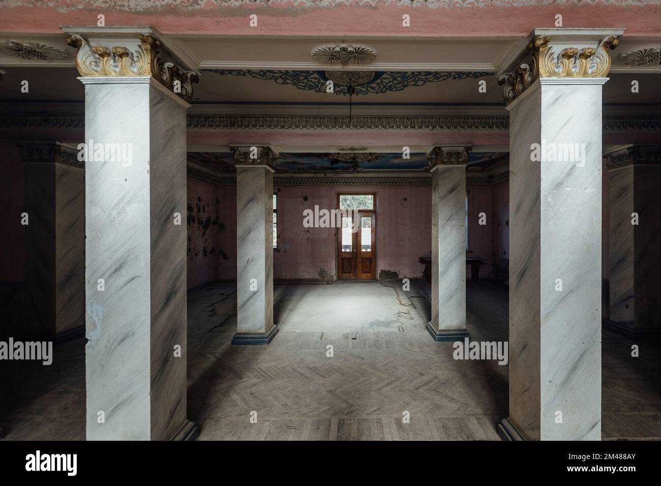 Large entrance hall with columns in old abandoned mansion Stock Photo ...