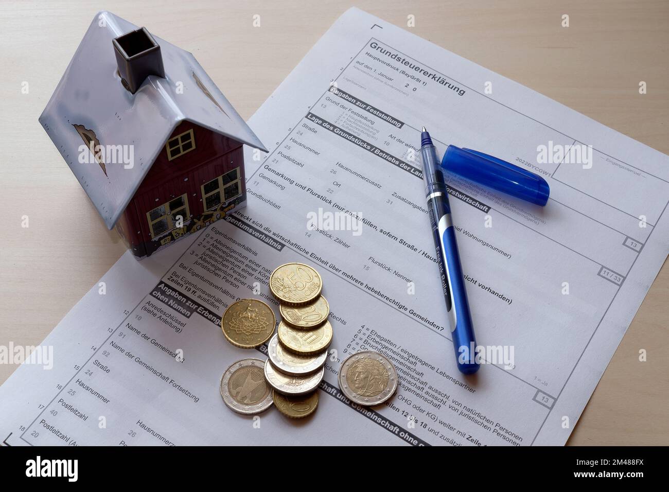 Symbol image property tax reform: tax return form with house, pen and ...