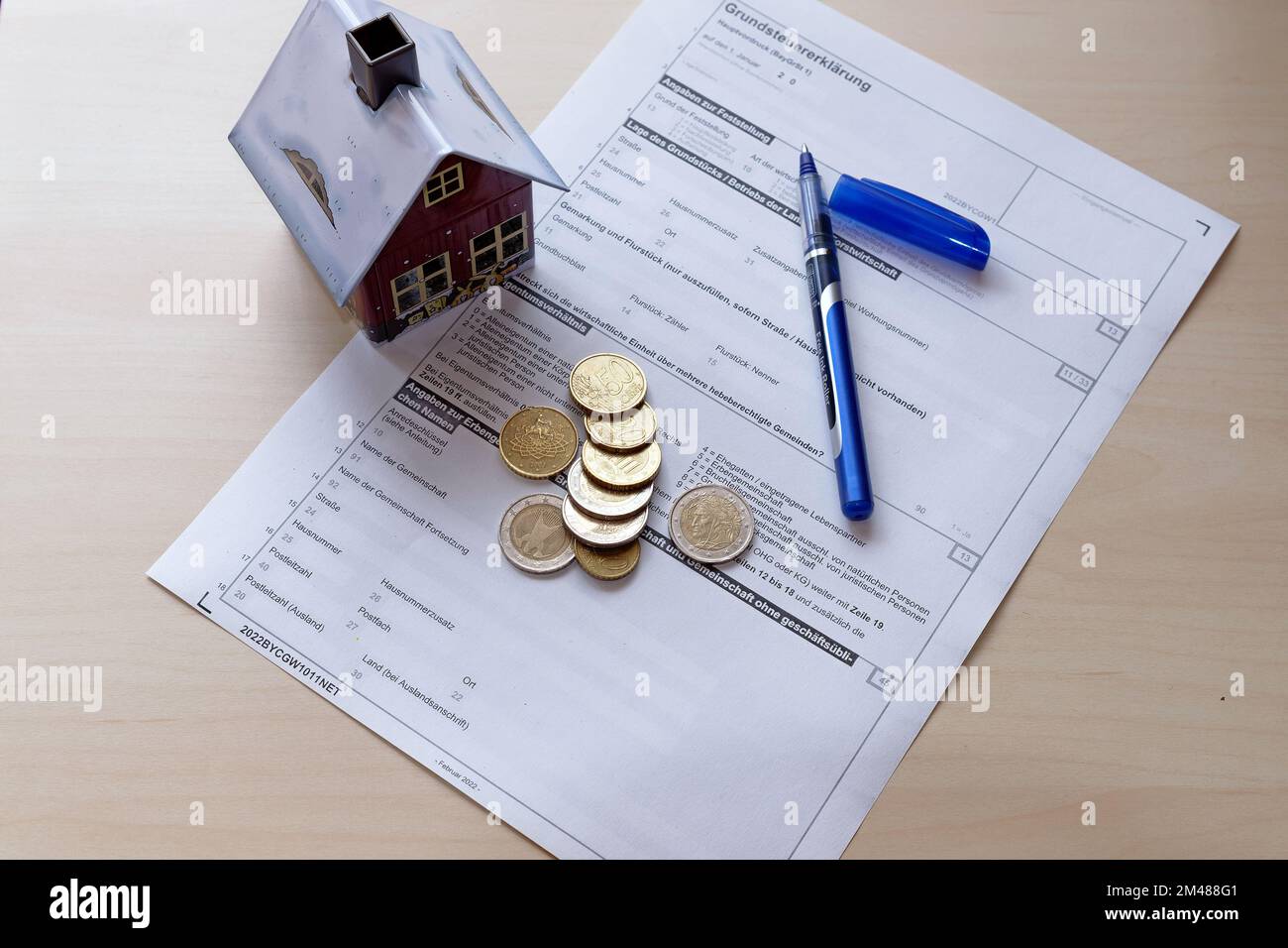 Symbol image property tax reform: tax return form with house, pen and ...